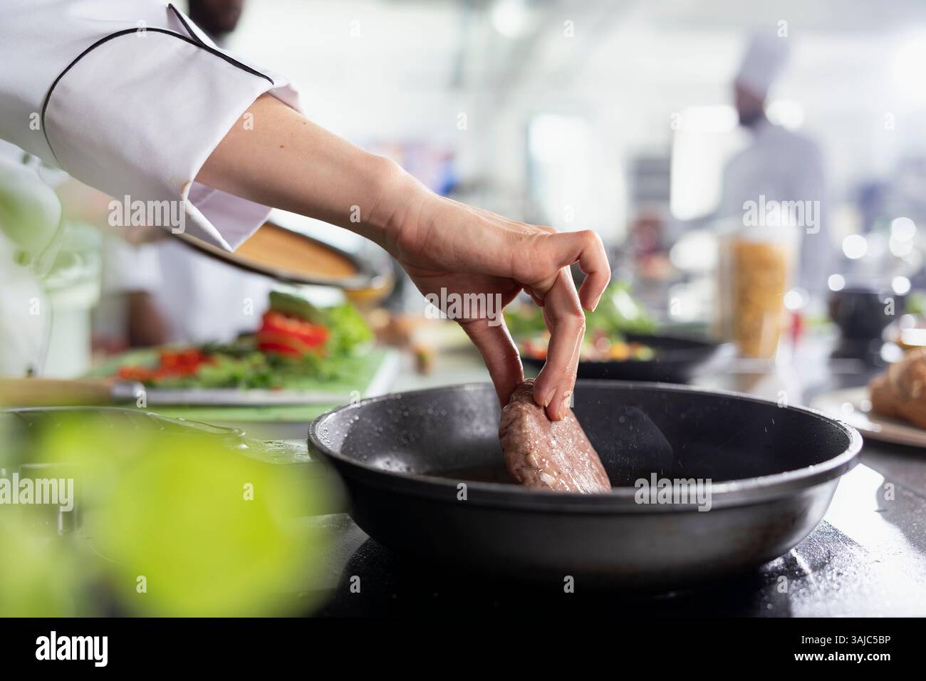Woman flipping steak cooking on hi-res stock photography and images - Alamy