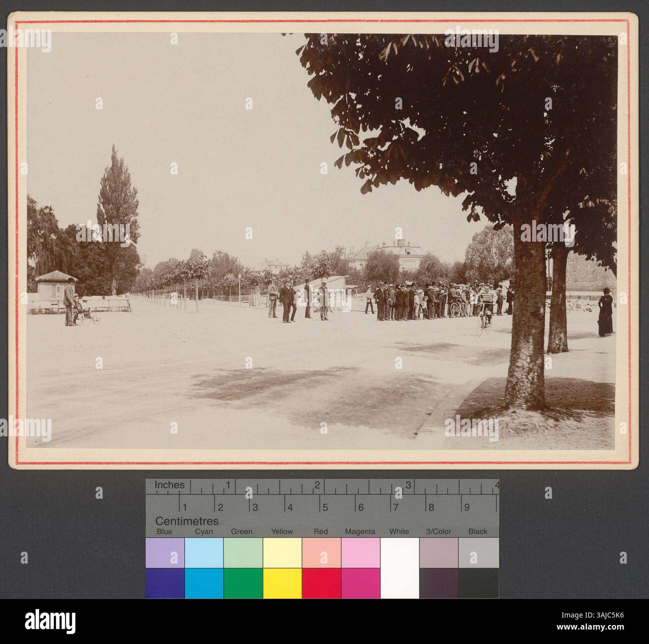 This 1891 photo shows a bicycle race with a rider heading toward Alfred ...