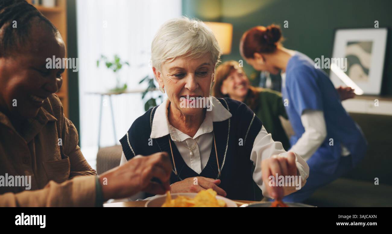 Senior women and retirement with eating in home with conversation ...