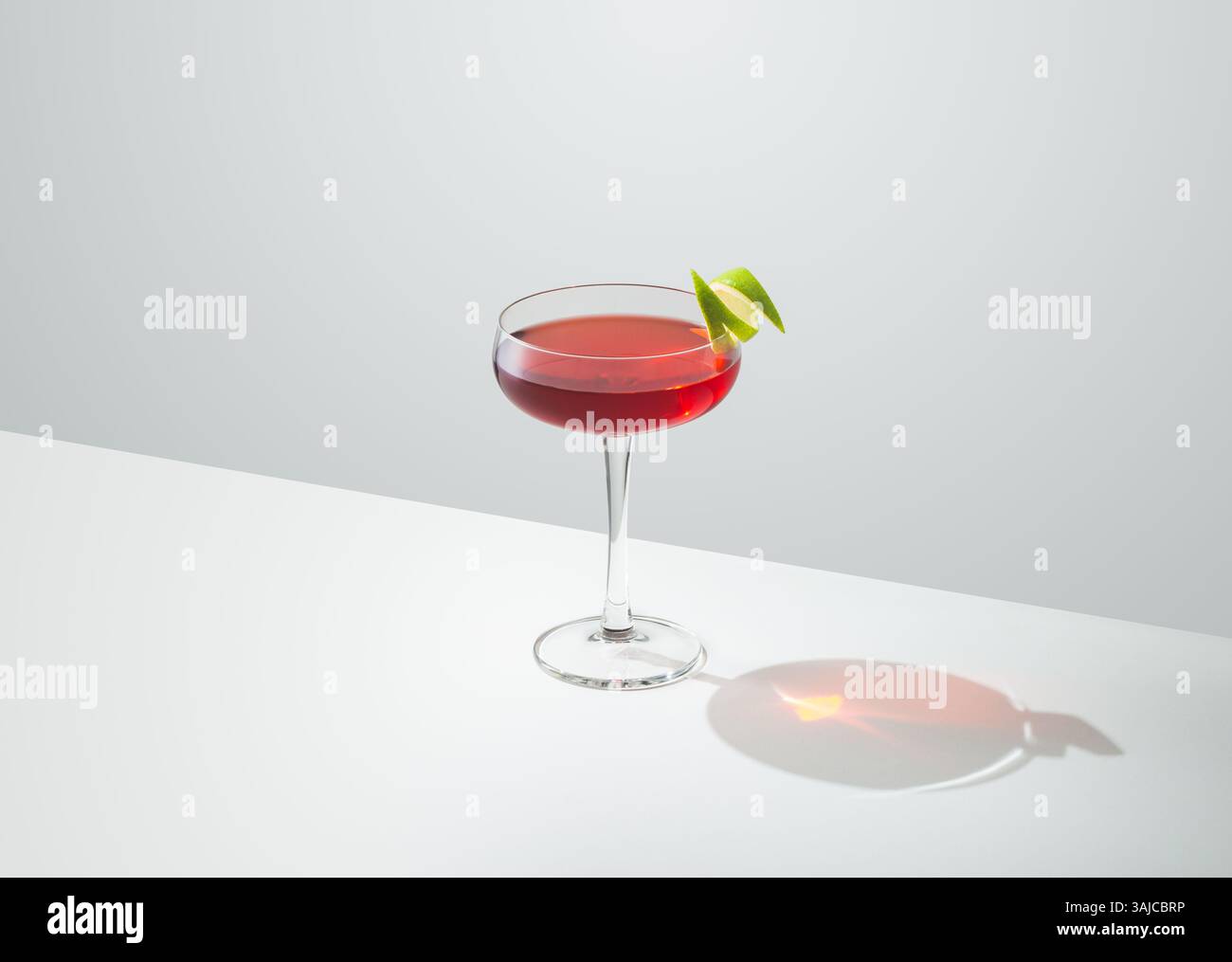Cosmopolitan Cocktail on table with grey background. minimalist concept ...