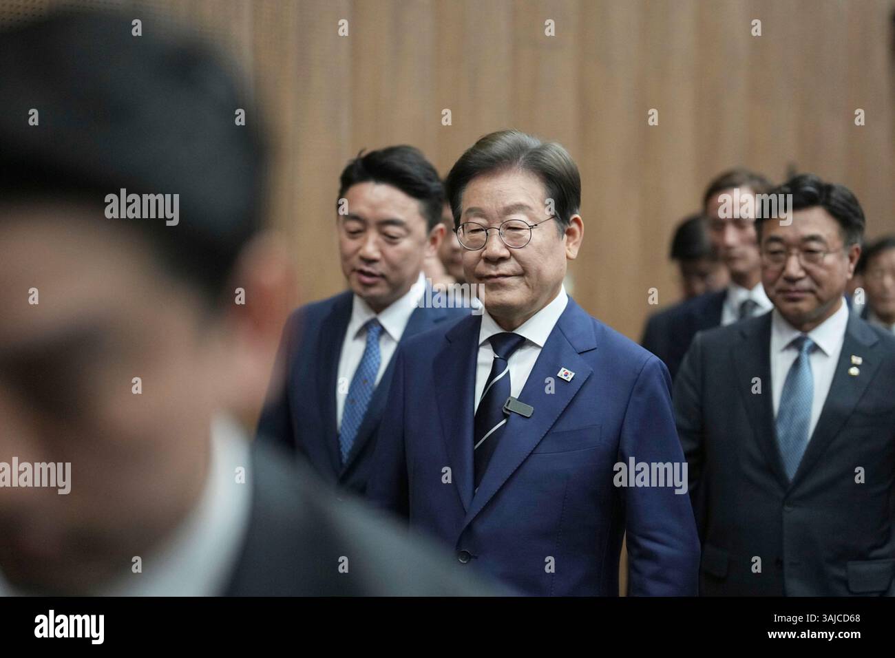 A former South Korea's main opposition Democratic Party leader Lee Jae-myung, center, leaves ...