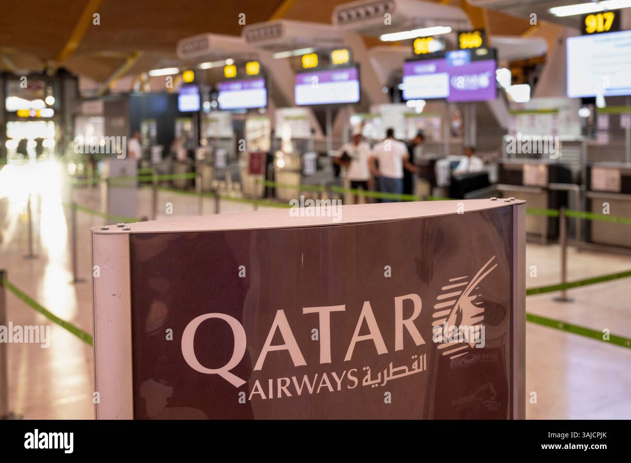 A Qatar Airways sign at the check-in counter in the Departure Hall of ...