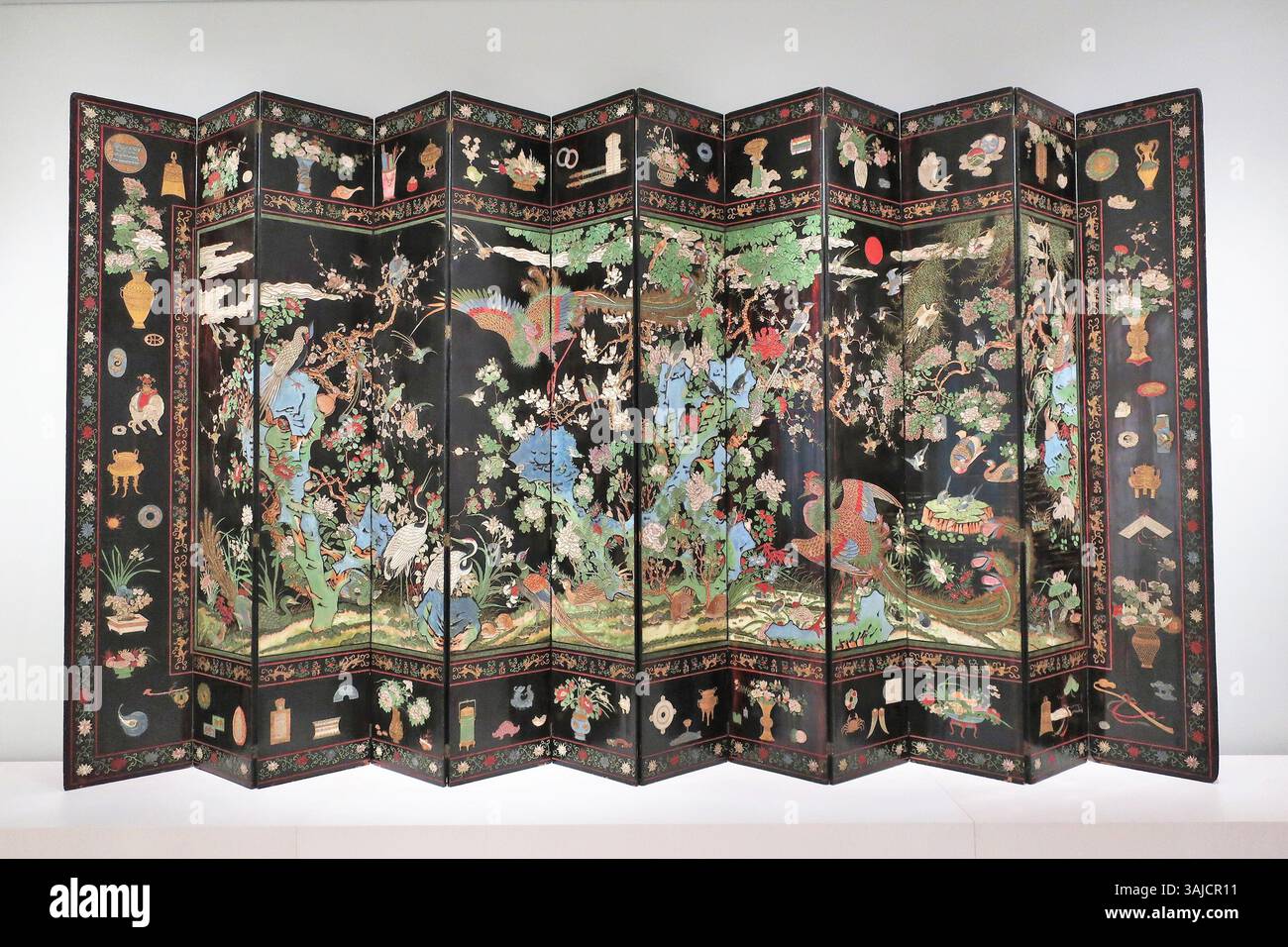 A twelve-panel Coromandel lacquer screen featuring one hundred birds ...
