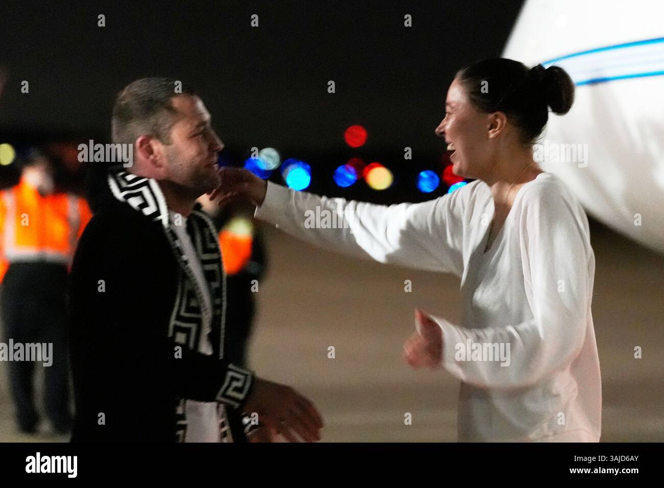 Ksenia Karelina greets her fiancé, professional boxer Chris van Heerden ...