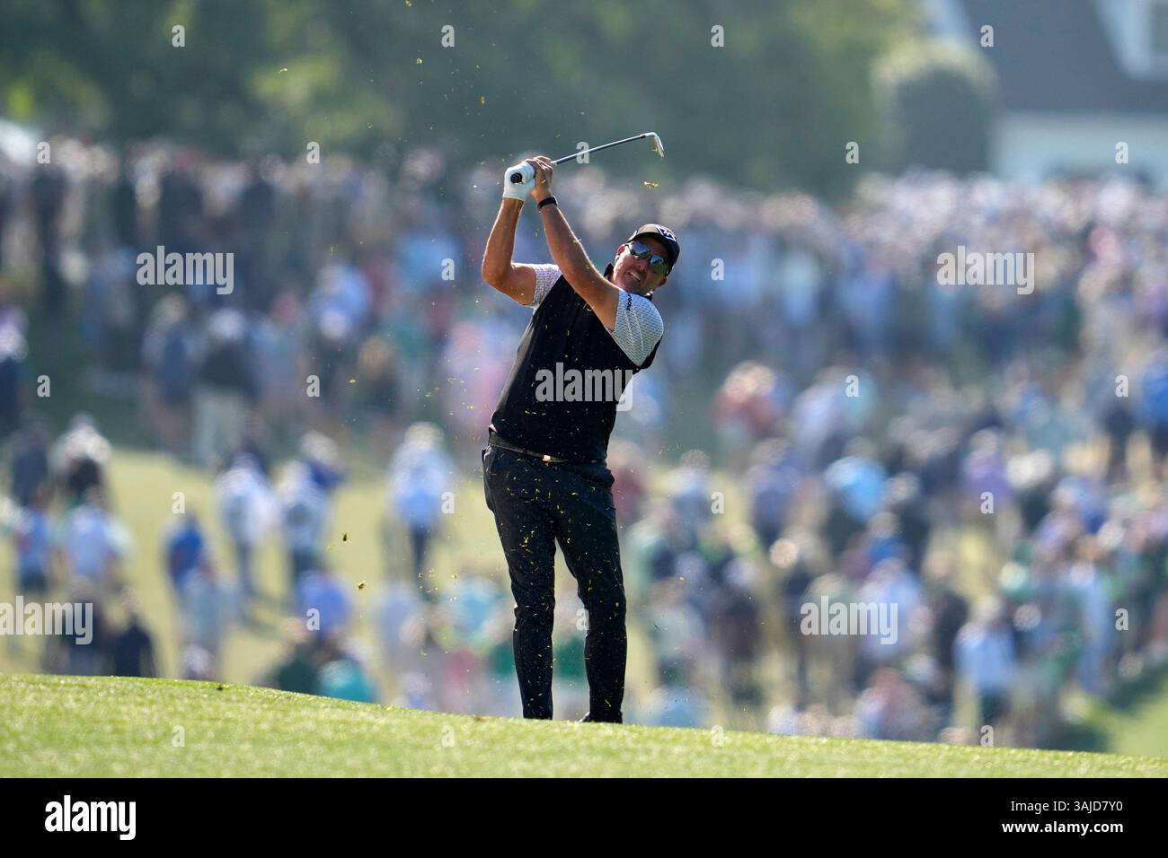Phil Mickelson hits from the fairway on the first hole during the first ...