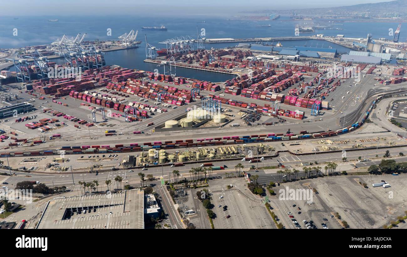 An aerial view of the Port of Long Beach reveals a vast, bustling trade ...