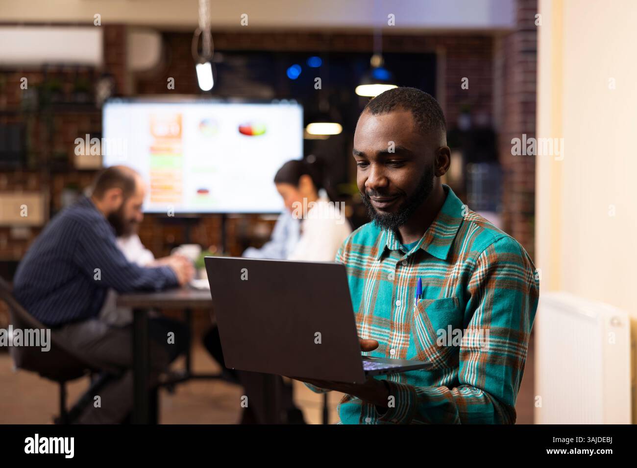 Professional black man deeply engaged in project planning, reviews ...