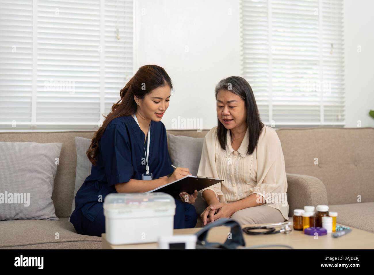 Patient Consultation and Care Planning. Nurse discussing health ...