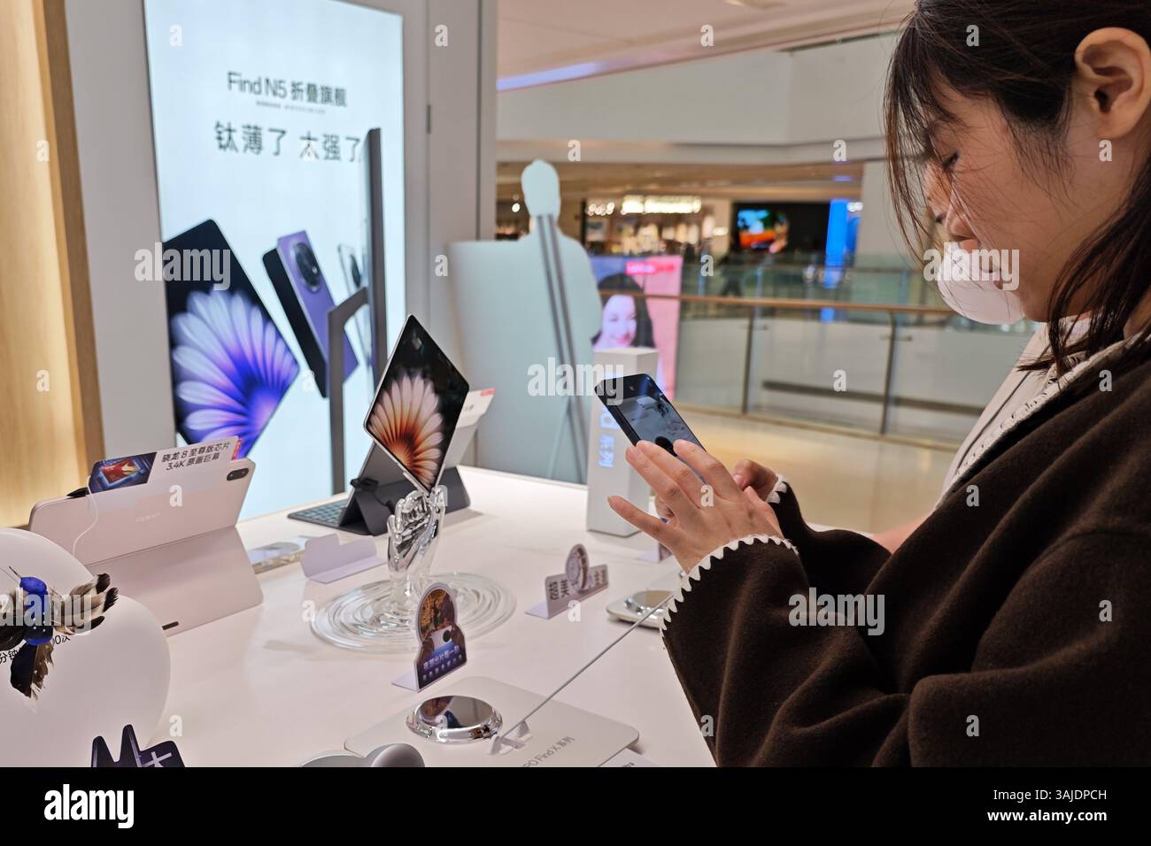 SHANGHAI, CHINA - APRIL 11, 2025 - A customer experiences OPPO's newly ...