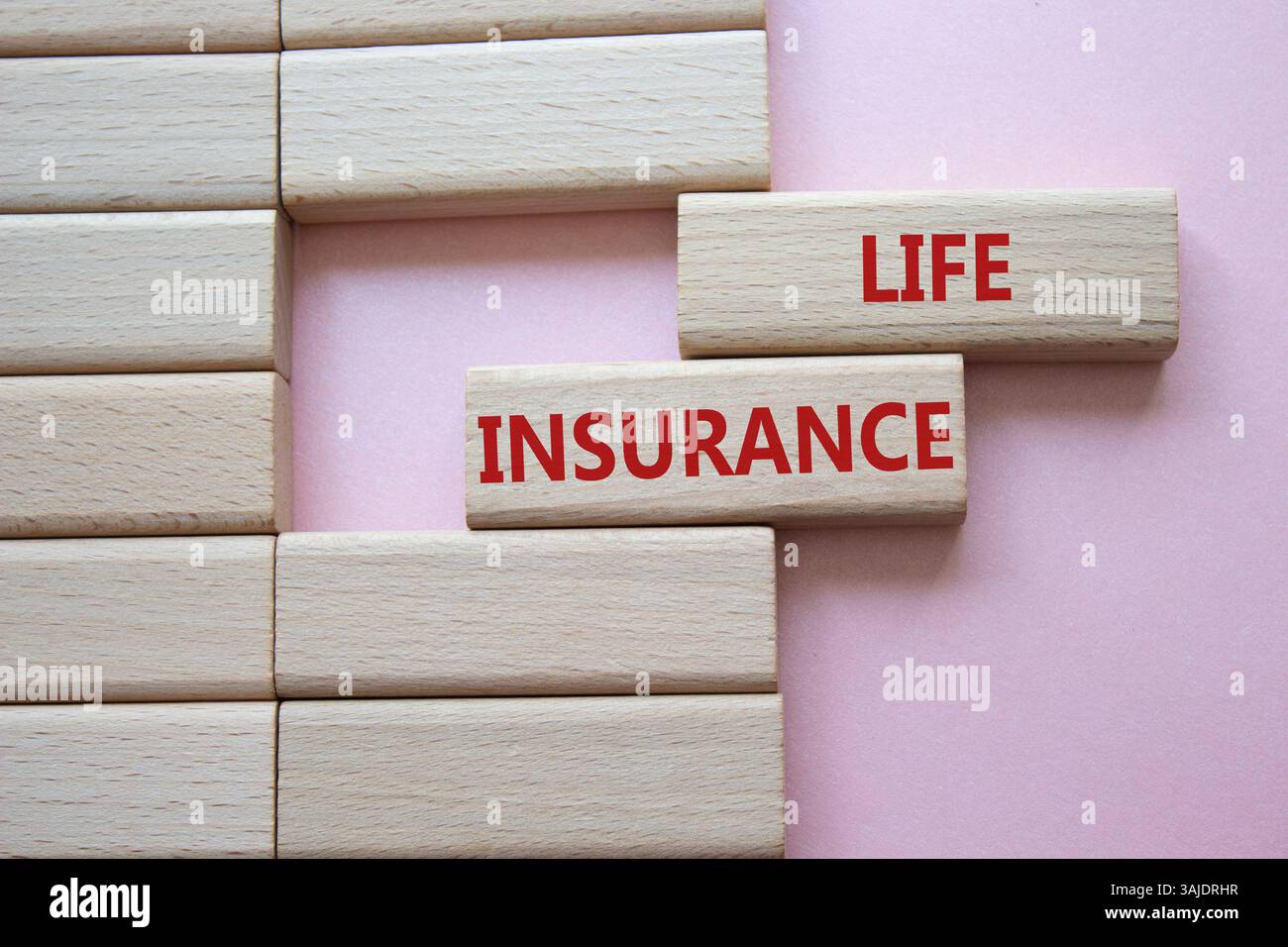 Life insurance symbol. Concept word Life insurance on wooden blocks ...