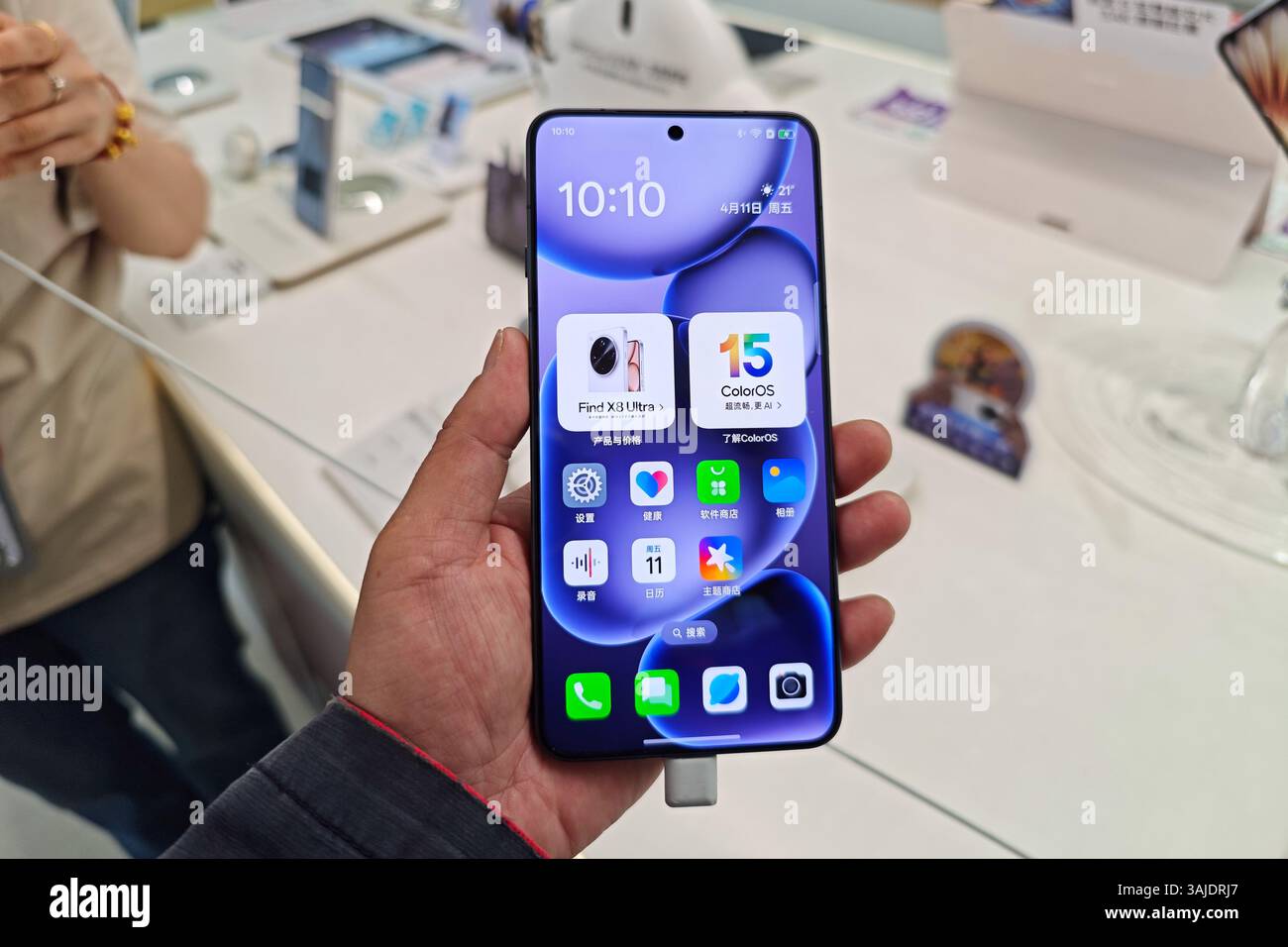 SHANGHAI, CHINA - APRIL 11, 2025 - A customer experiences OPPO's newly ...