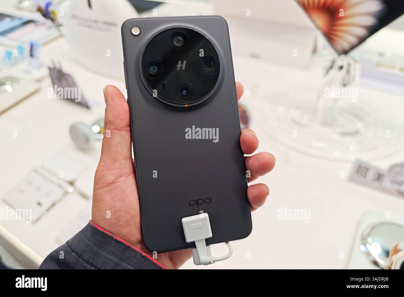 SHANGHAI, CHINA - APRIL 11, 2025 - A customer experiences OPPO's newly ...