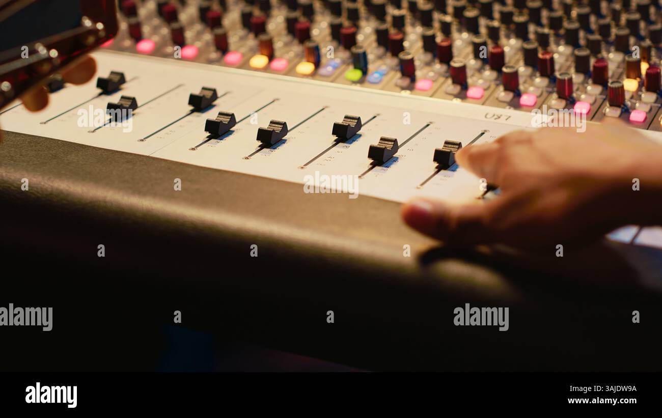 Skilled artist guitarist recording a new song with electro acoustic ...