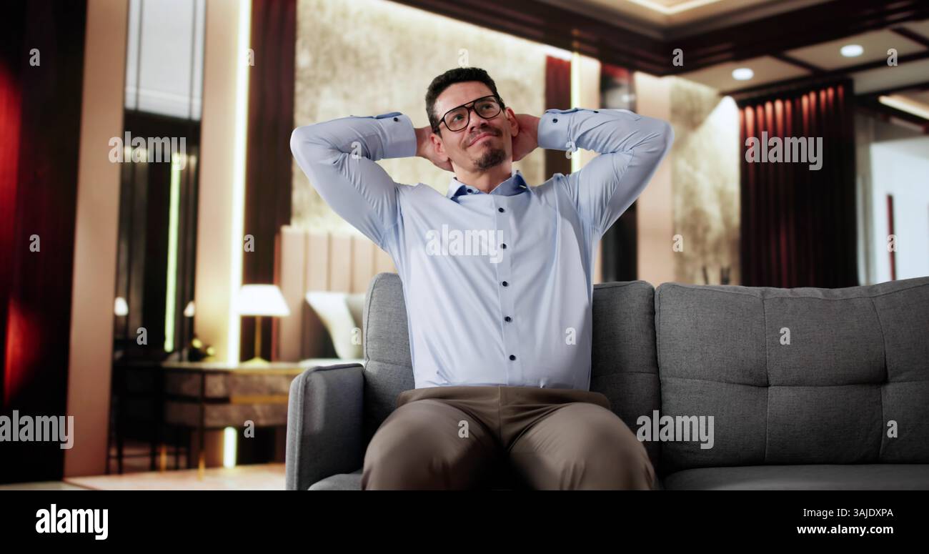 Man sitting on sofa thinking hi-res stock photography and images - Alamy