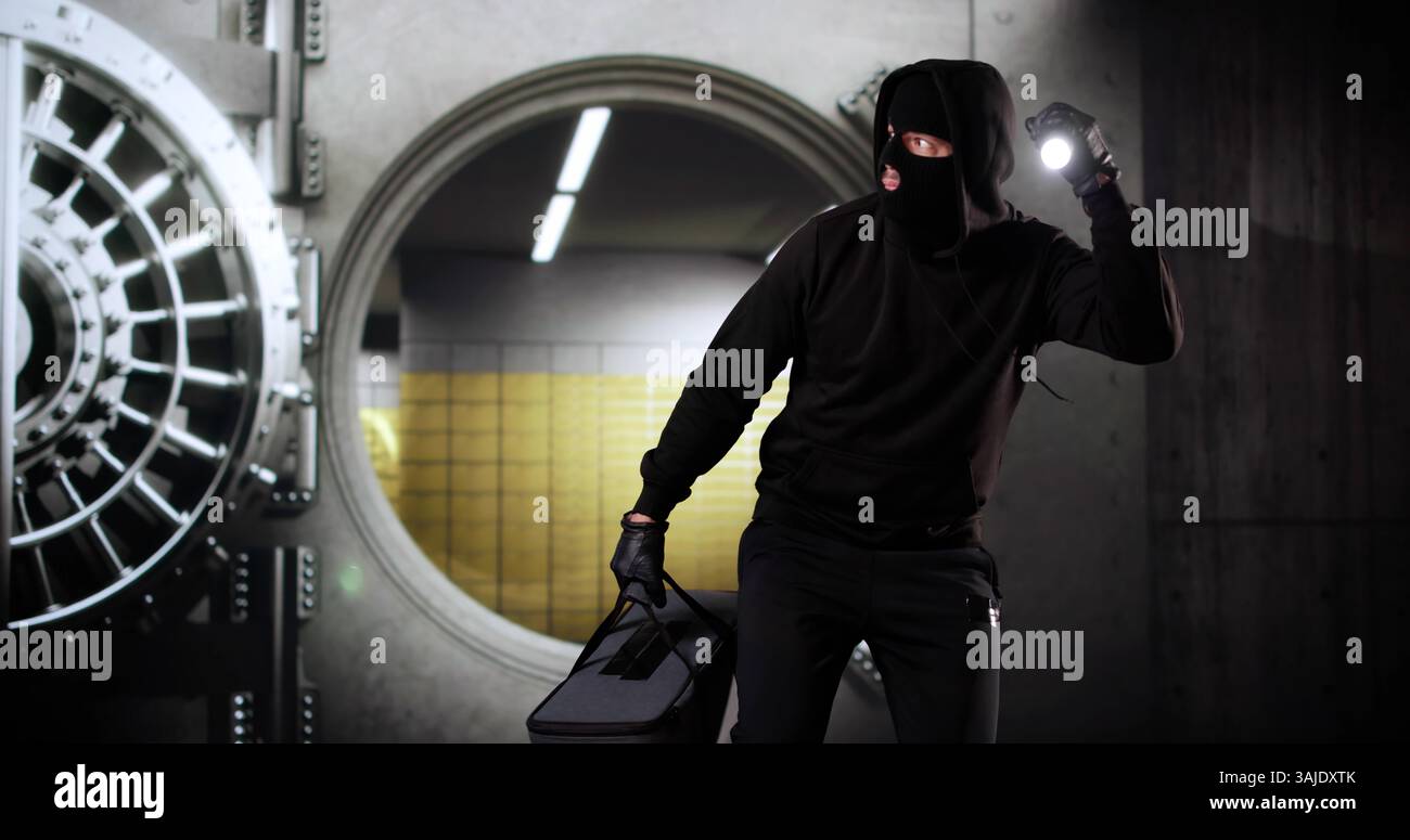 Vault Bank Robbery By Thief In Mask Stock Photo - Alamy