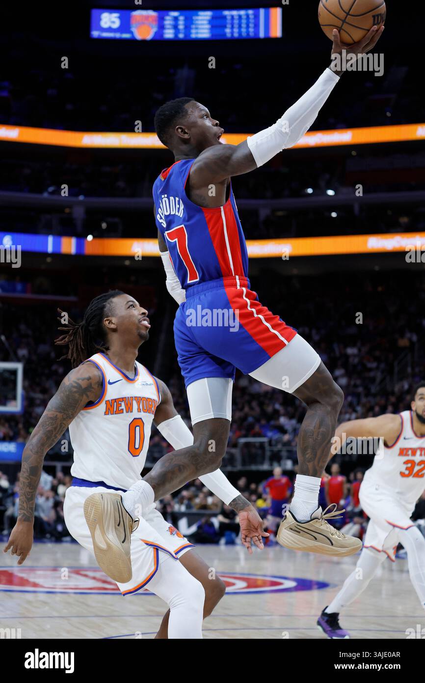 Detroit Pistons guard Dennis Schroder, right, goes to the basket past New York Knicks guard ...