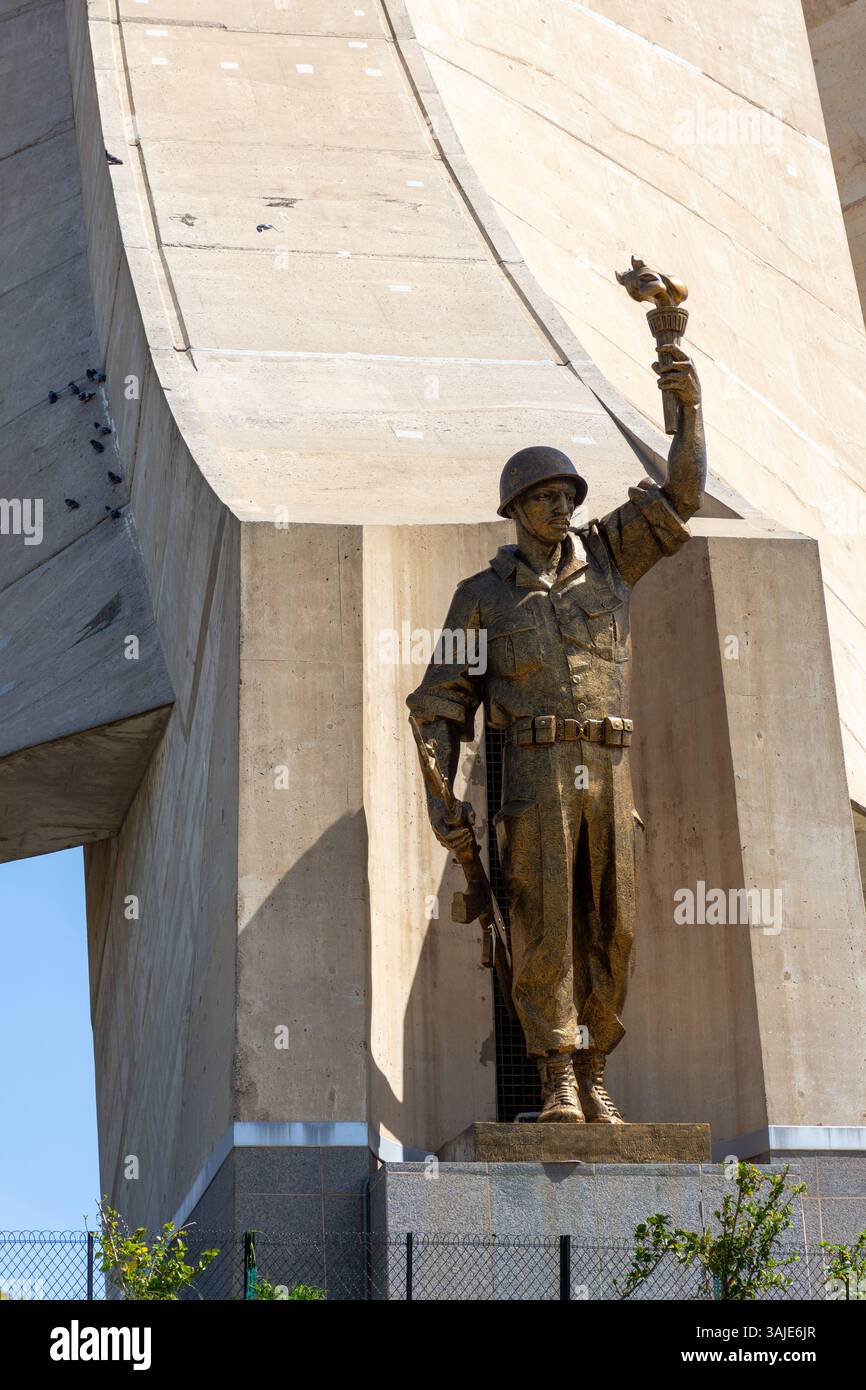 A soldier statue made of bronze holding a torch and gun in the Maqam ...