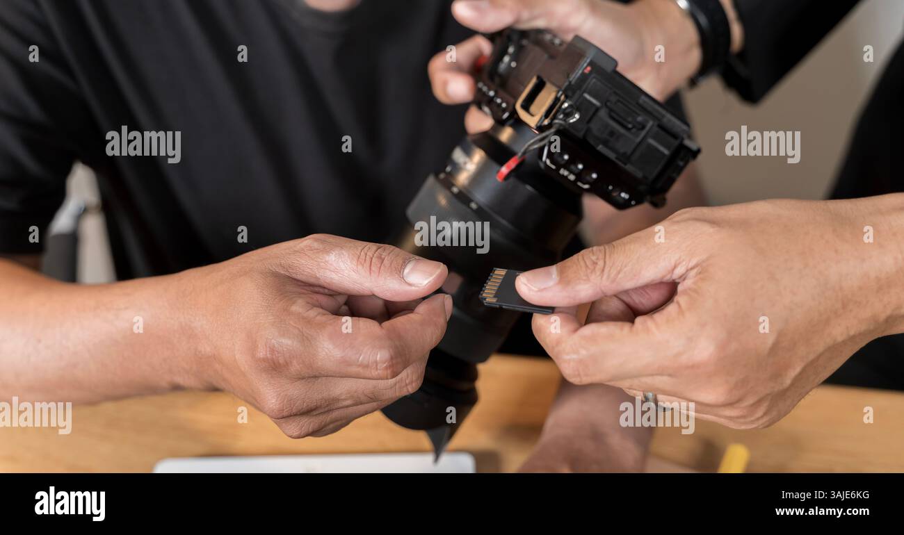 DSLR camera while working in home office. Photographers at their studio ...
