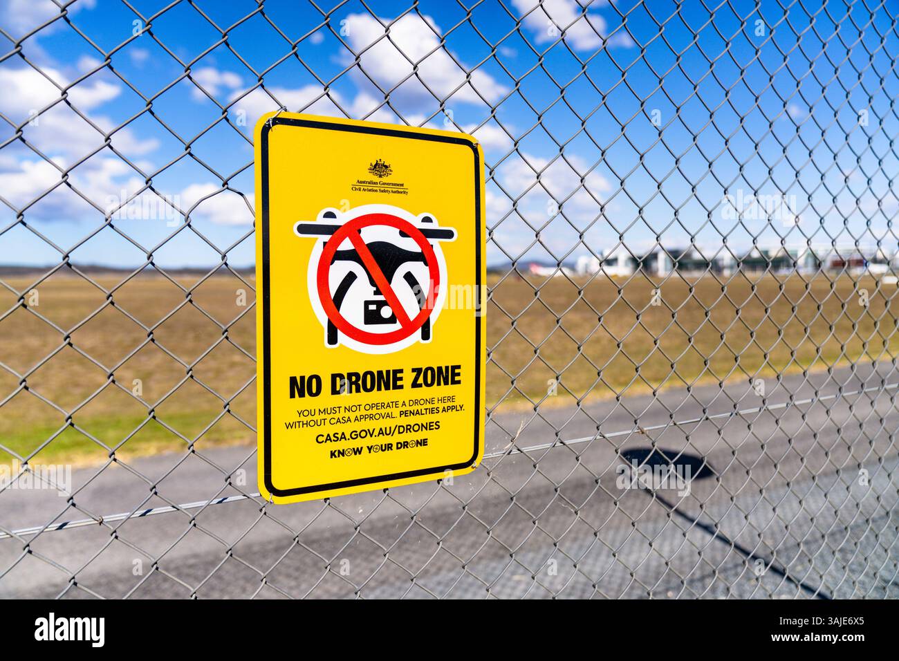 A 'No Drone Zone' sign is pictured at an Australian airport. The sign ...