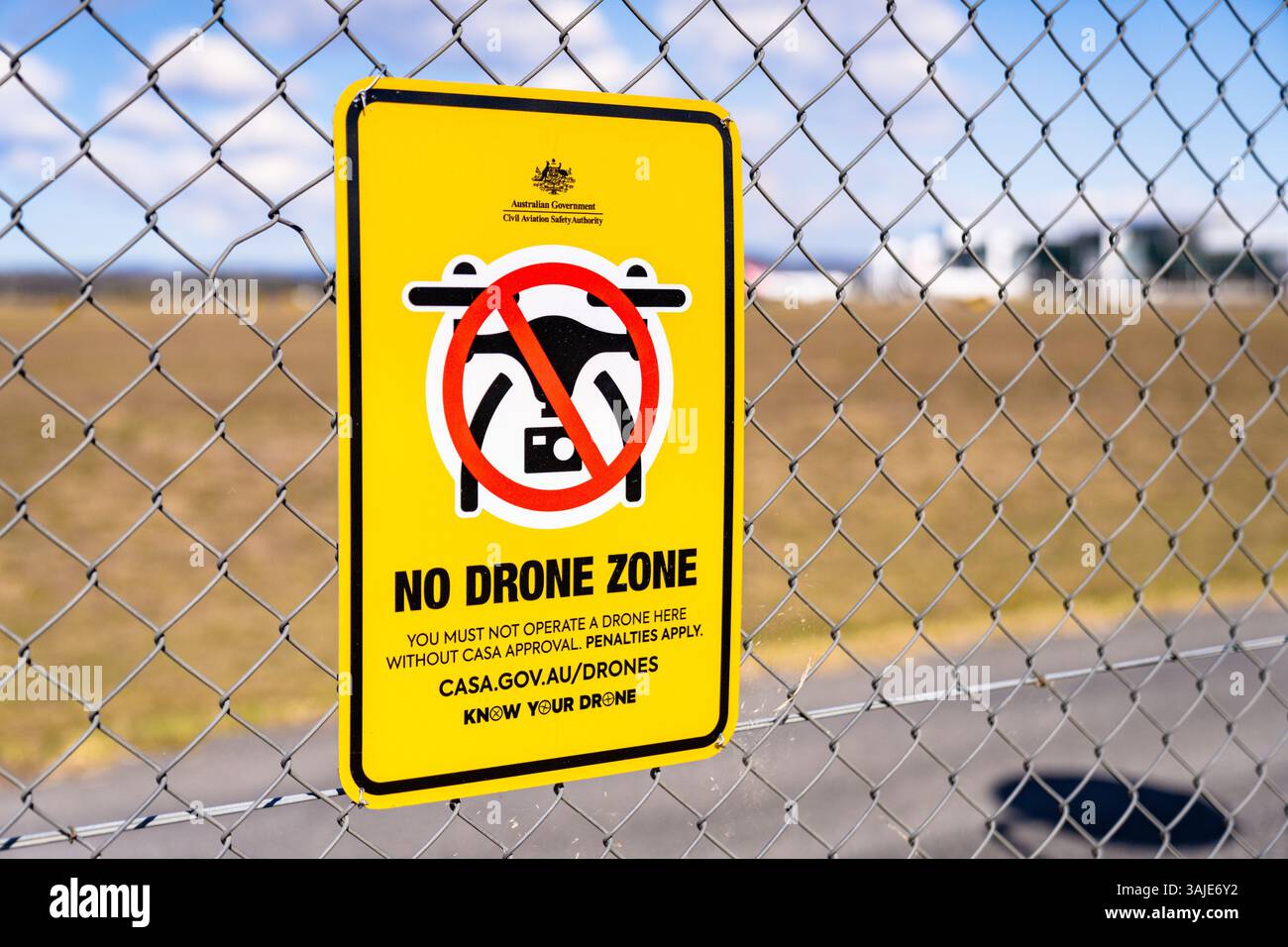 A 'No Drone Zone' sign is pictured at an Australian airport. The sign ...
