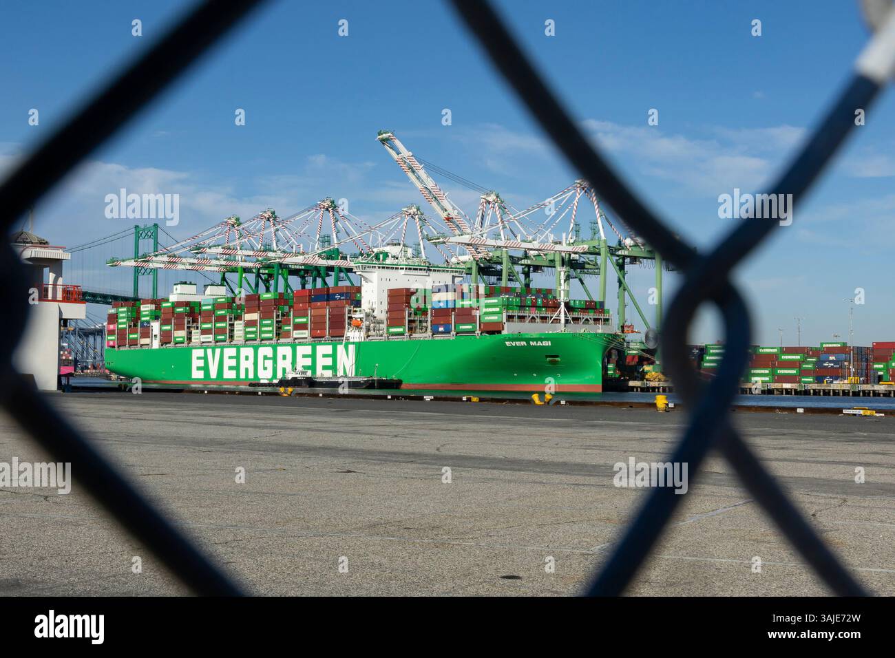 Shipping containers being loaded onto a cargo ship at the Port of Los ...