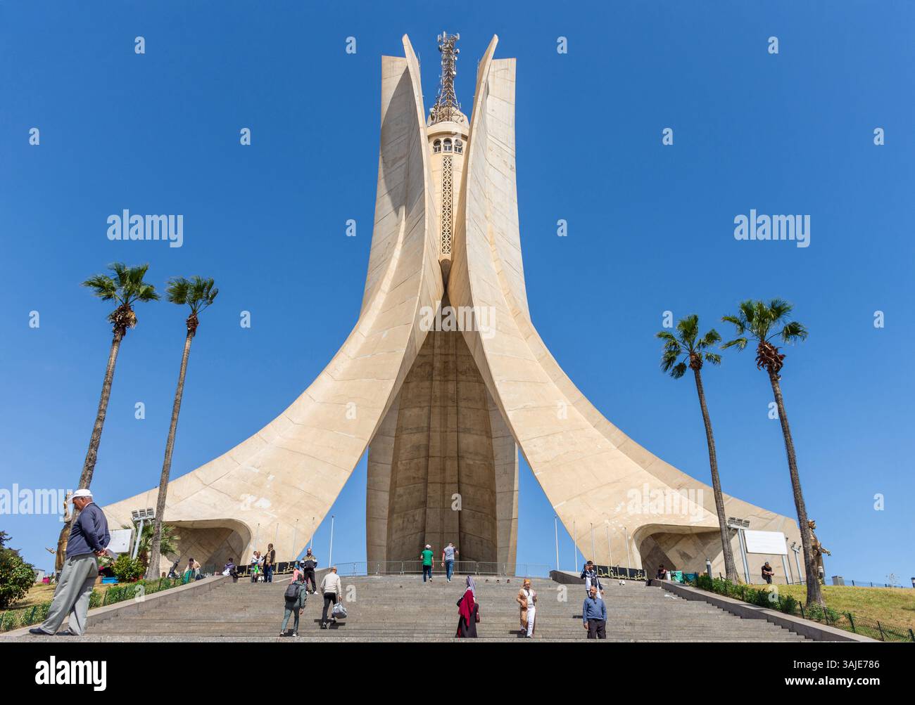 A group of people in Maqam Echahid Monument Square in Algiers City ...