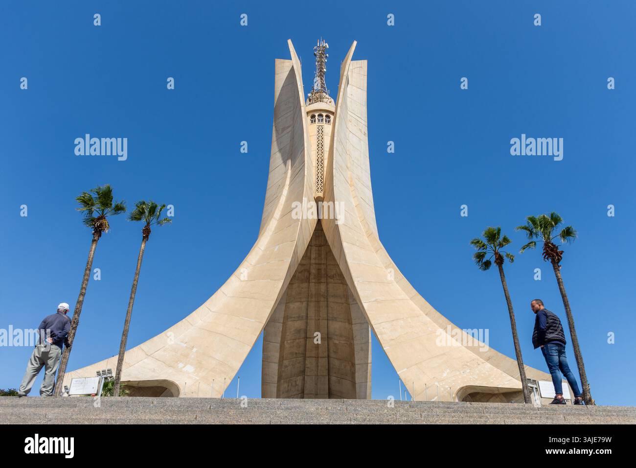 A group of people in Maqam Echahid Monument Square in Algiers City ...