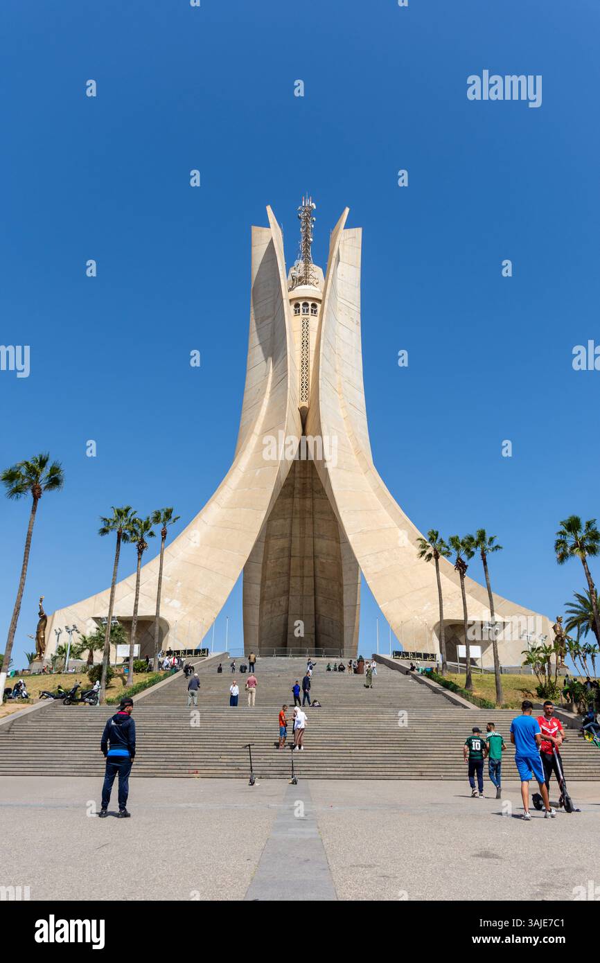 A group of people in Maqam Echahid Monument Square in Algiers City ...