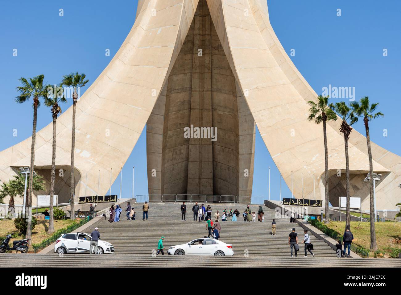 A group of people in Maqam Echahid Monument Square in Algiers City ...