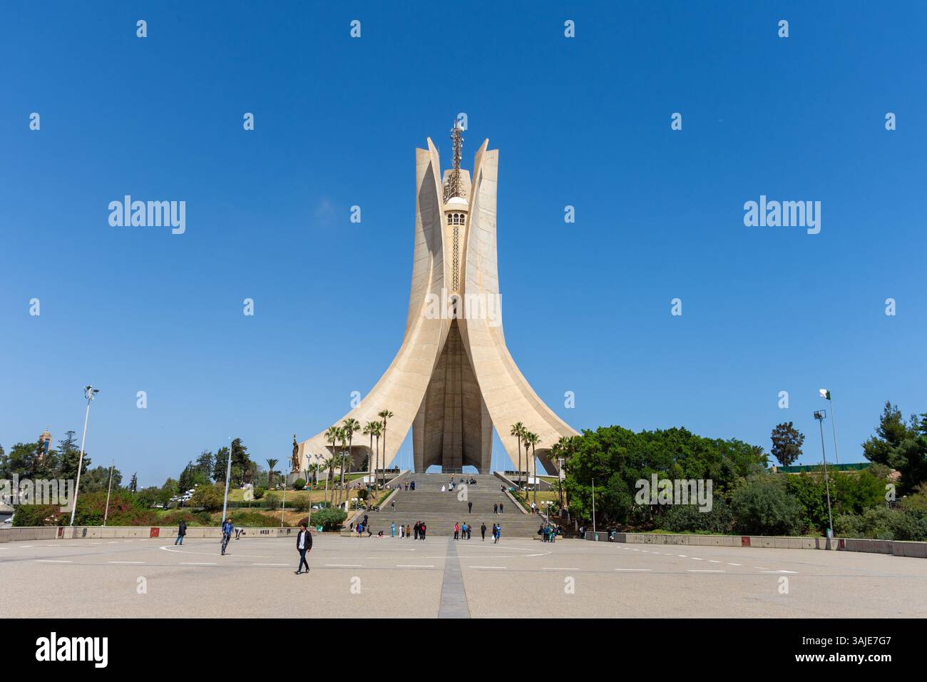 A group of people in Maqam Echahid Monument Square in Algiers City ...