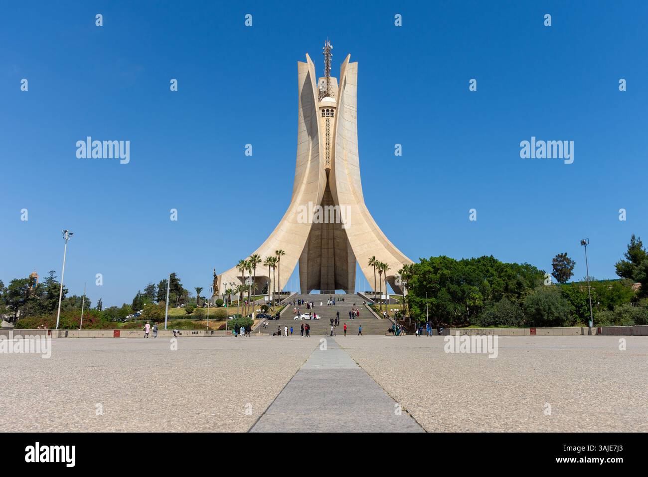 A group of people in Maqam Echahid Monument Square in Algiers City ...
