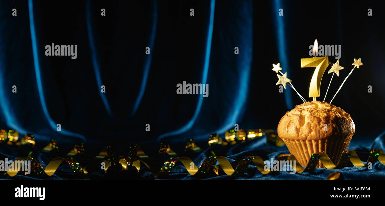 Coming age party 7th birthday. chocolate cupcake with number seven ...