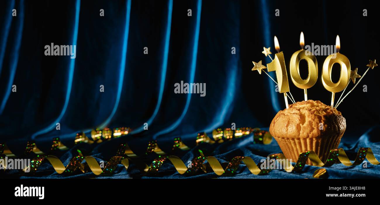 100 birthday celebrating. Number 100 gold celebration candle and small ...