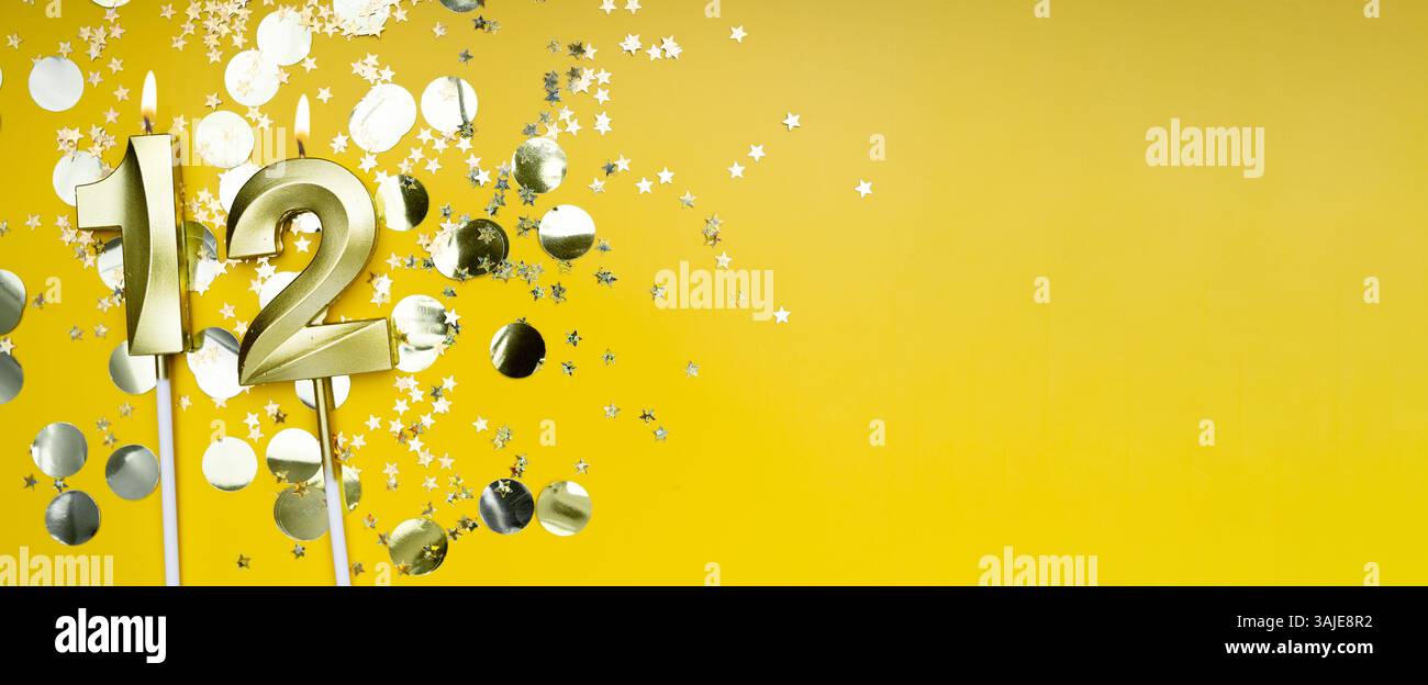 Golden candle number twelve on yellow background. Birthday card with ...