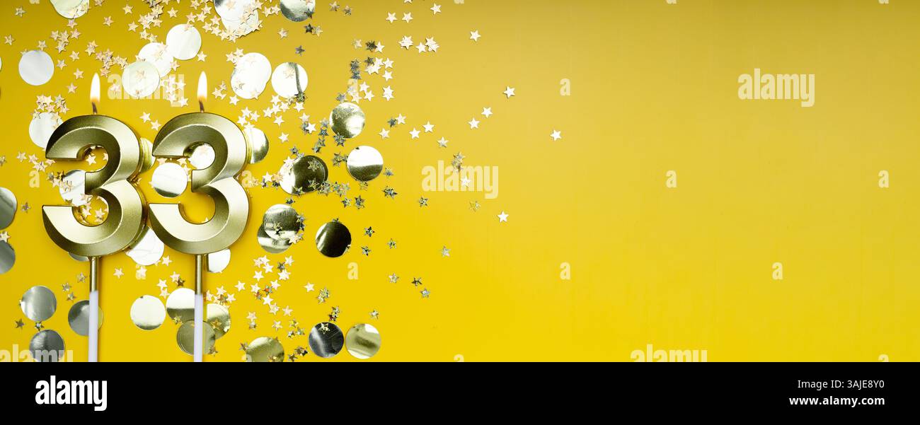 Golden candle number thirty-three on yellow background. Birthday card ...