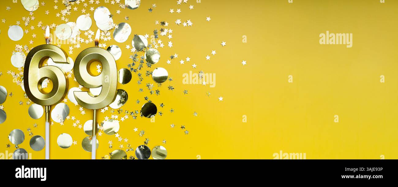 Sixty-nine years birthday. Number 69 golden celebration candle. Yellow ...