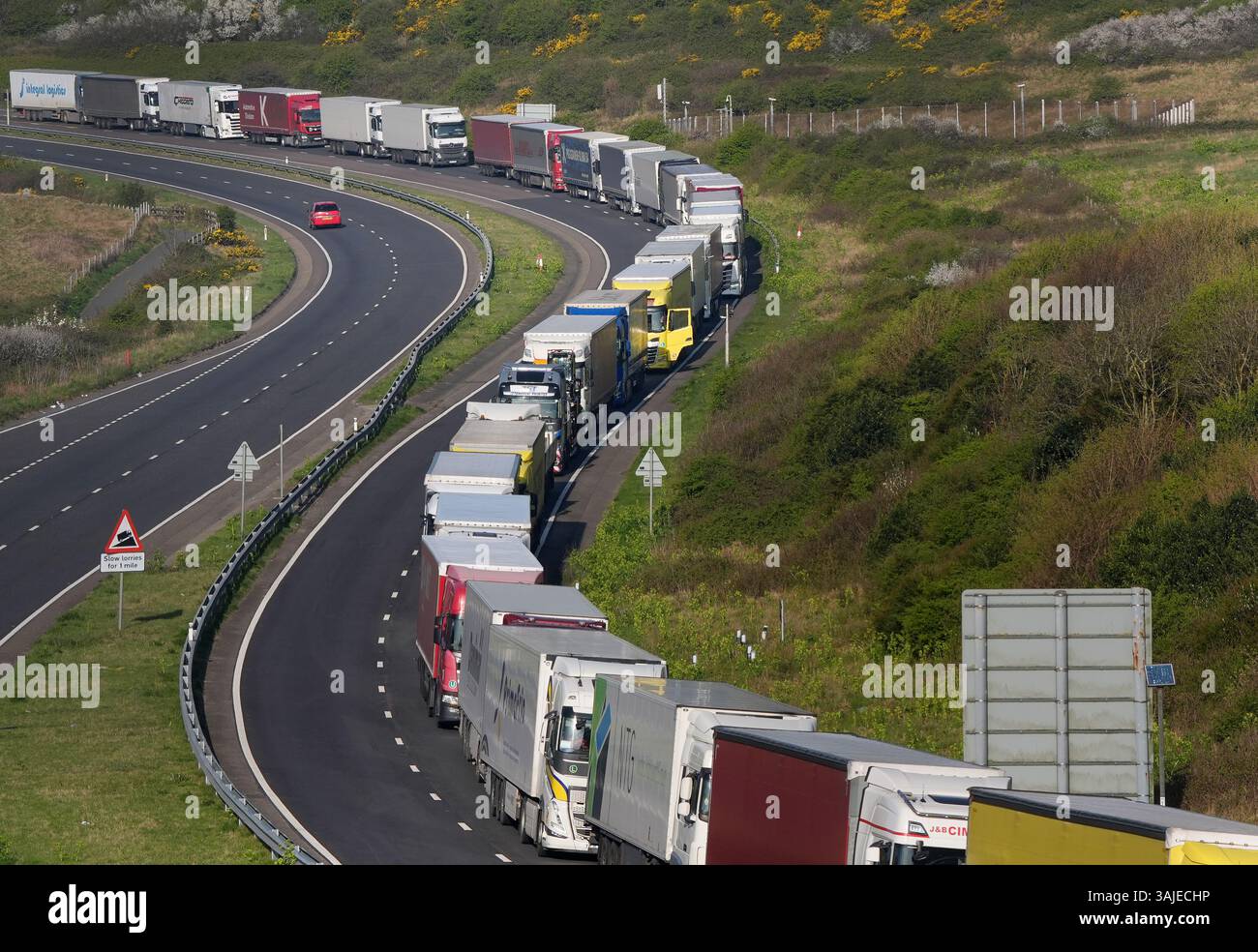 Lorries queue along the A20 outside Dover in Kent as the TAP traffic ...