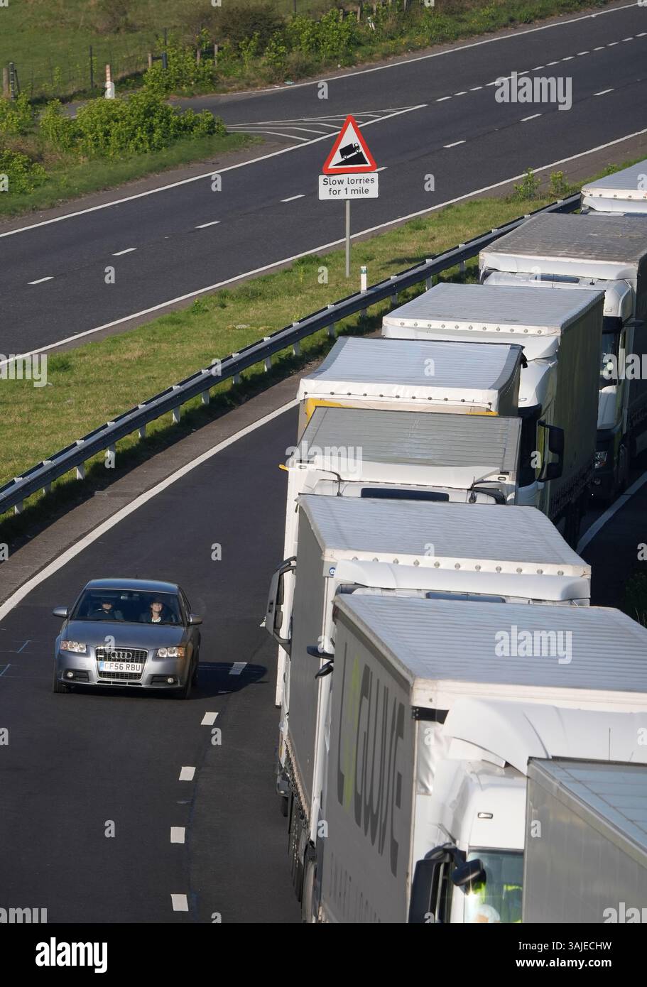 Lorries queue along the A20 outside Dover in Kent as the TAP traffic ...