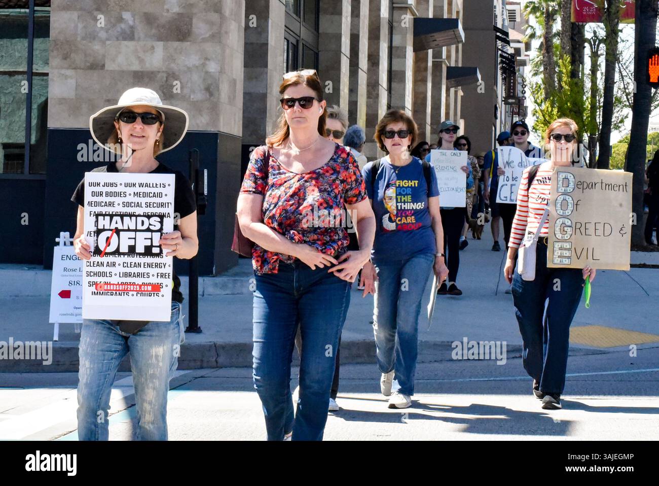 April 5, 2025, Pasadena, Califronia, USA: Protesters hold up signs ...