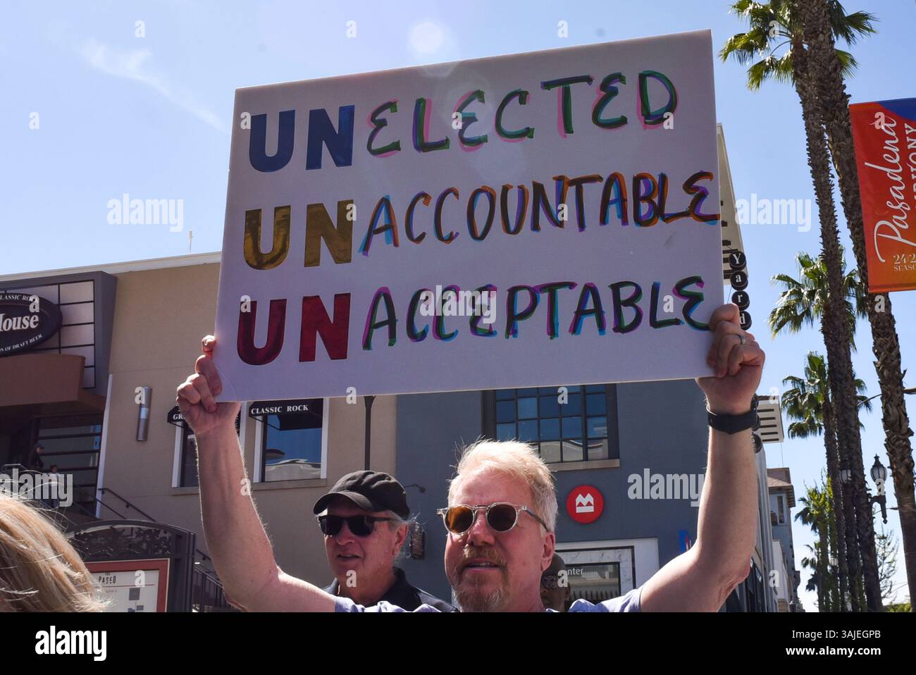 April 5, 2025, Pasadena, Califronia, USA: A protester holds a sign up ...