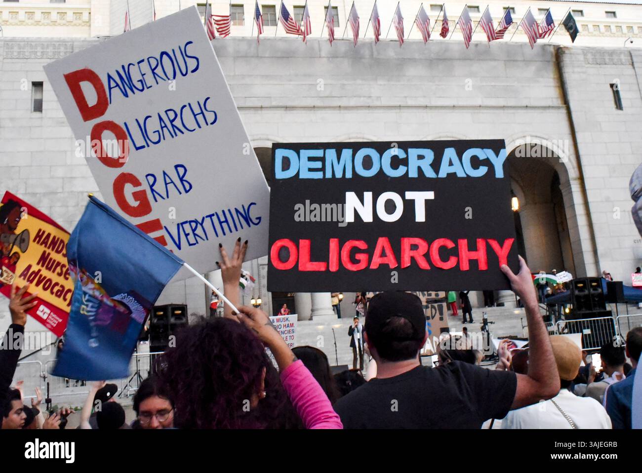 Los Angeles, Califronia, USA. 5th Apr, 2025. Protesters hold up signs ...