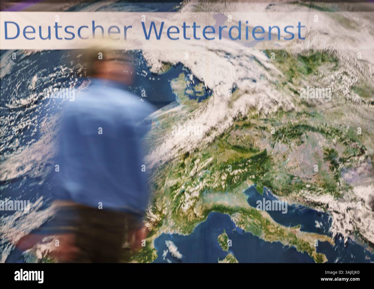 Offenbach, Germany. 11th Apr, 2025. A man is walking in front of an ...