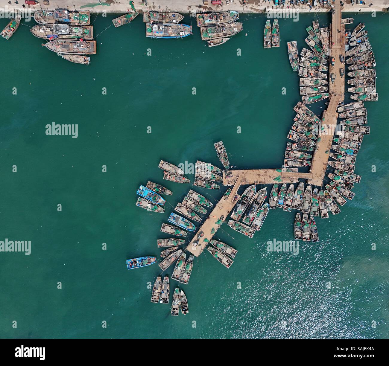YANTAI, CHINA - APRIL 11, 2025 - Fishing boats take shelter from ...