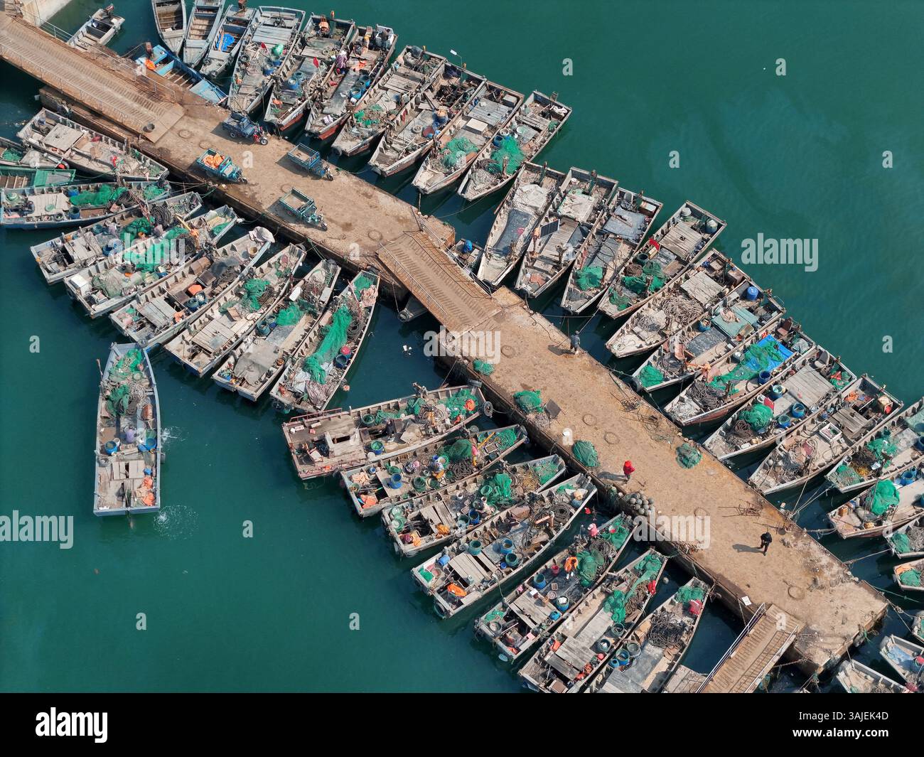 YANTAI, CHINA - APRIL 11, 2025 - Fishing boats take shelter from ...