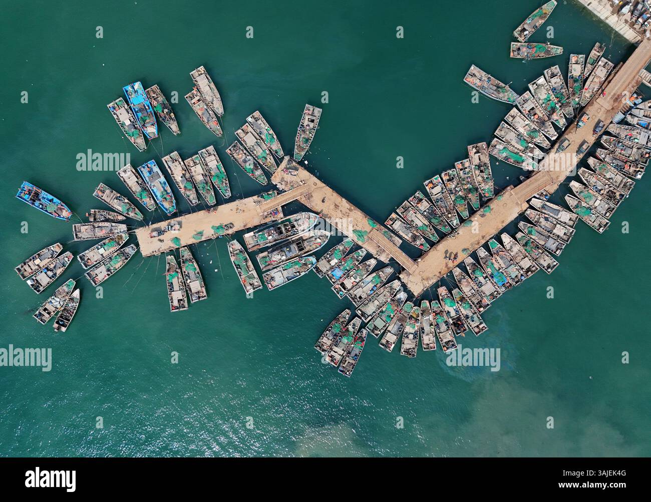 YANTAI, CHINA - APRIL 11, 2025 - Fishing boats take shelter from ...