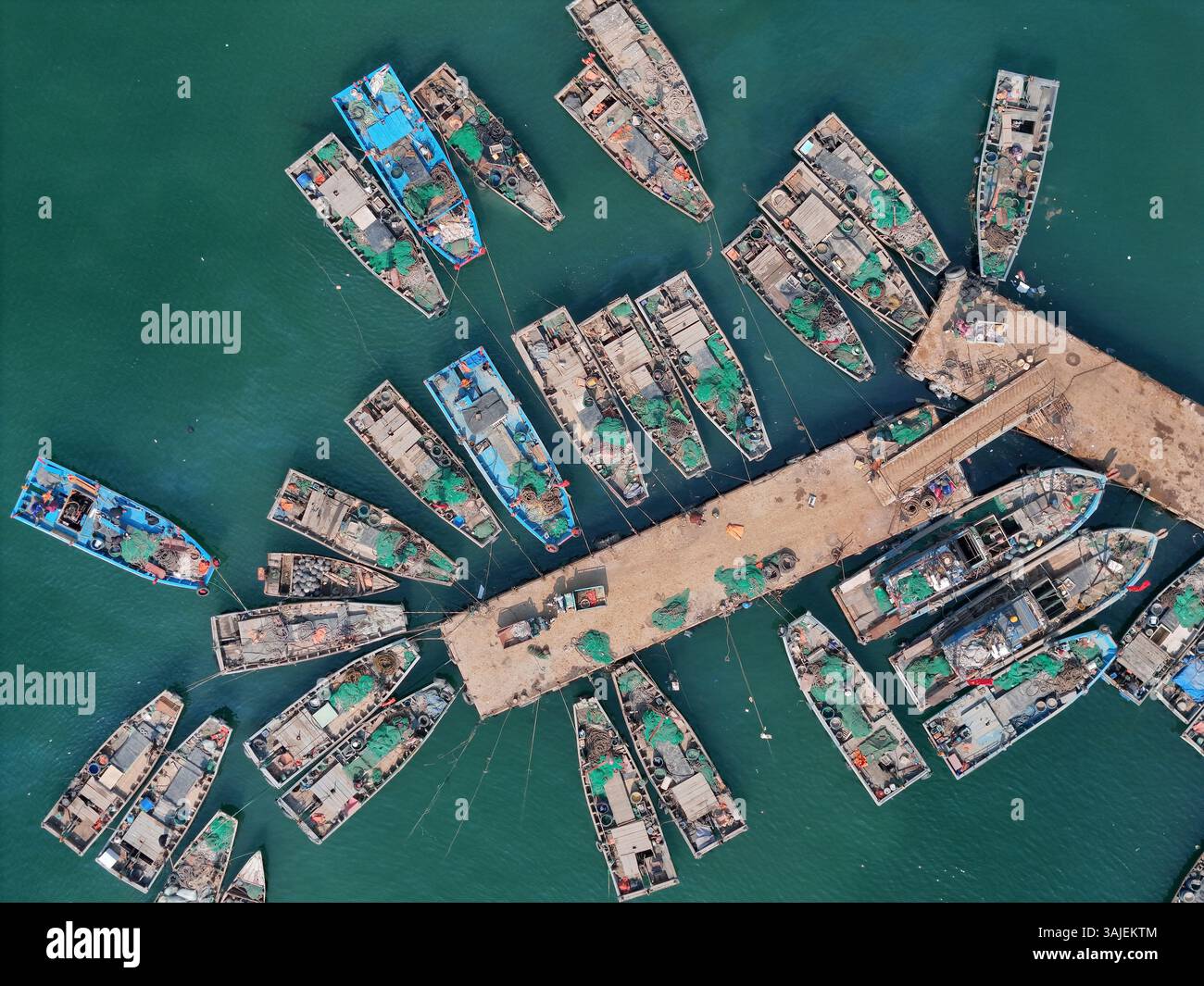 YANTAI, CHINA - APRIL 11, 2025 - Fishing boats take shelter from ...