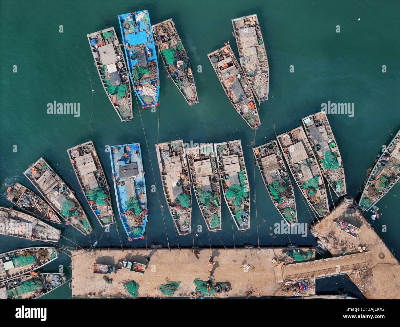YANTAI, CHINA - APRIL 11, 2025 - Fishing boats take shelter from ...