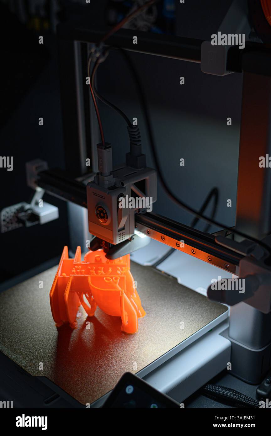 3D Printer Creating Vibrant Orange Prototype Model Stock Photo - Alamy