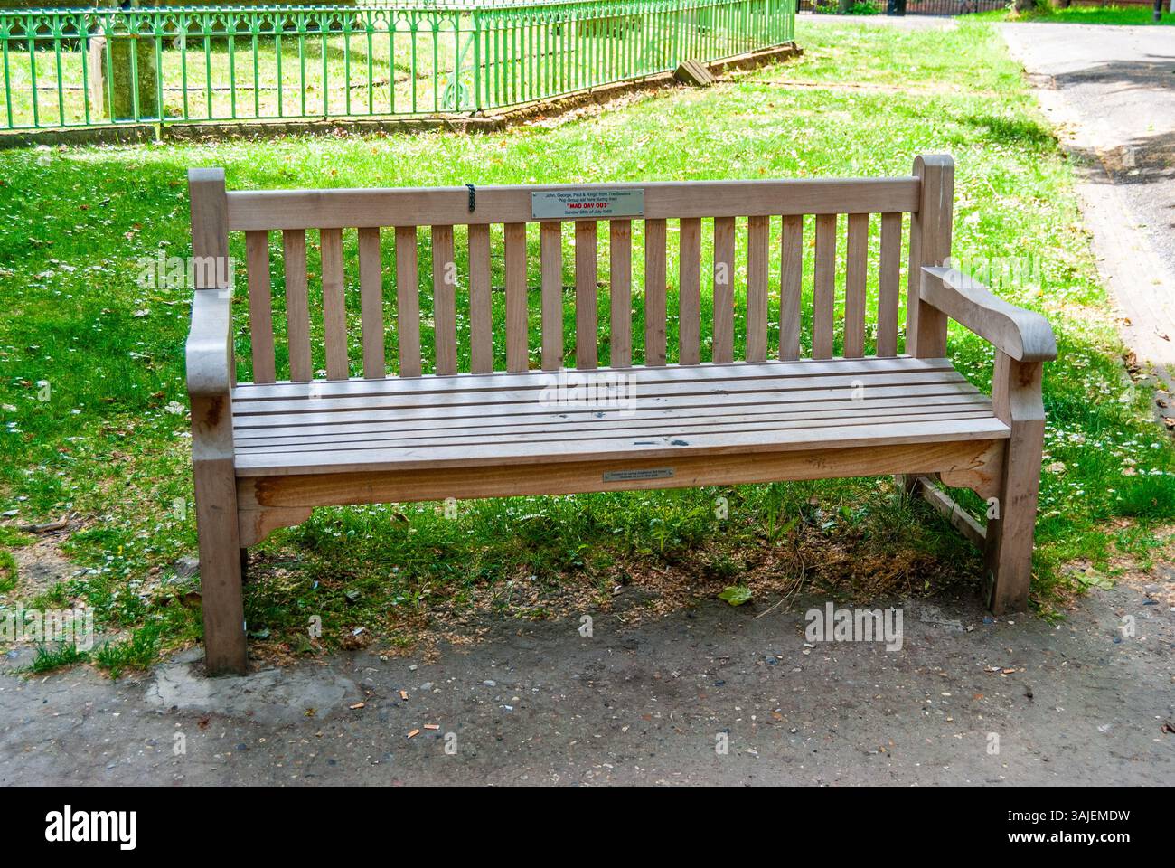 Bench where Beatles pop group members sit in 1968, in the garden of St ...