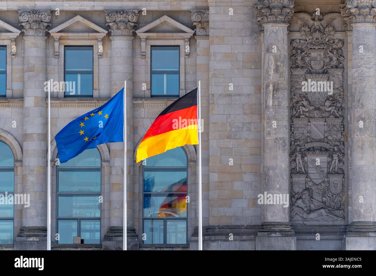 Two flags, the European and the German, flutter against the backdrop of ...
